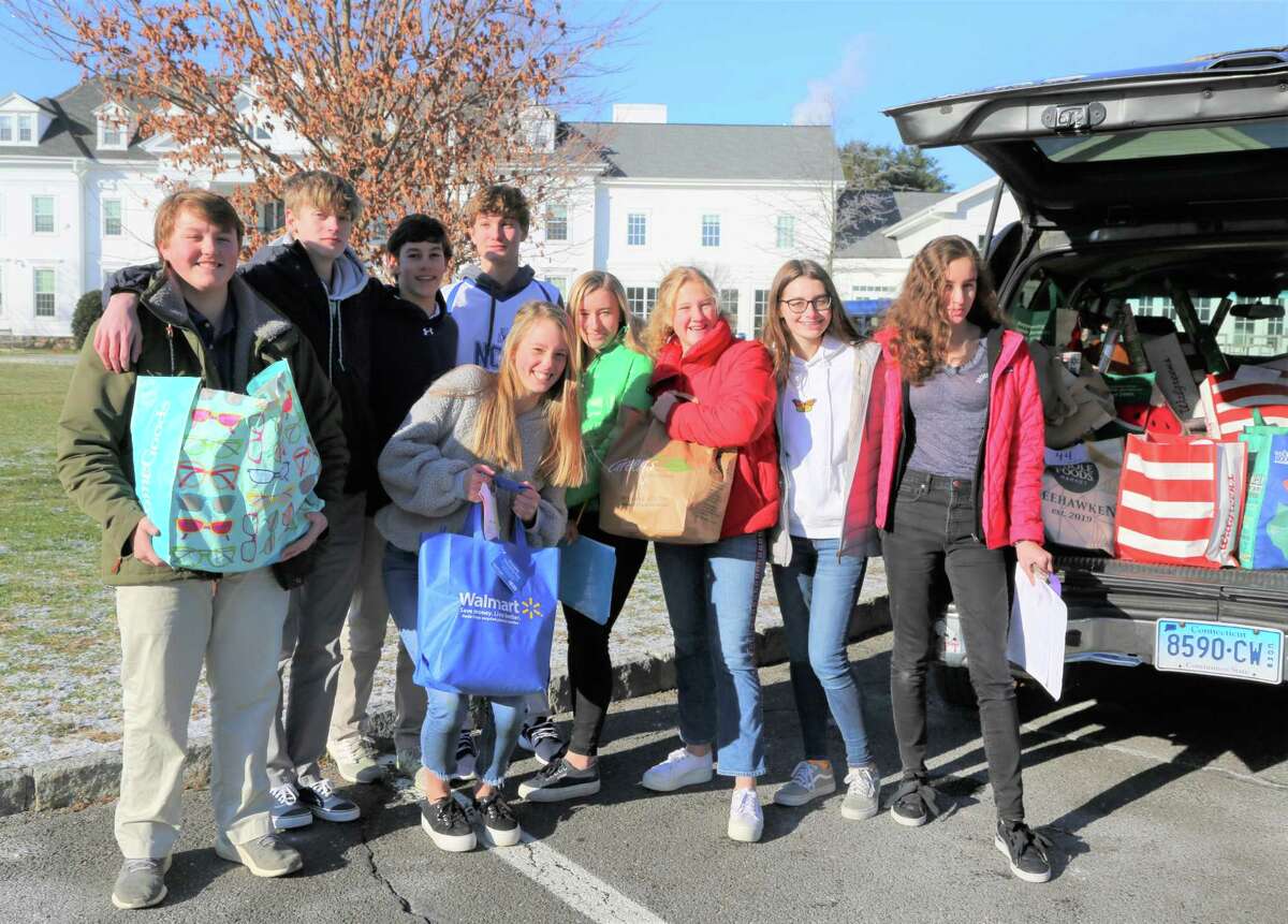 New Canaan Country School ninth graders give items