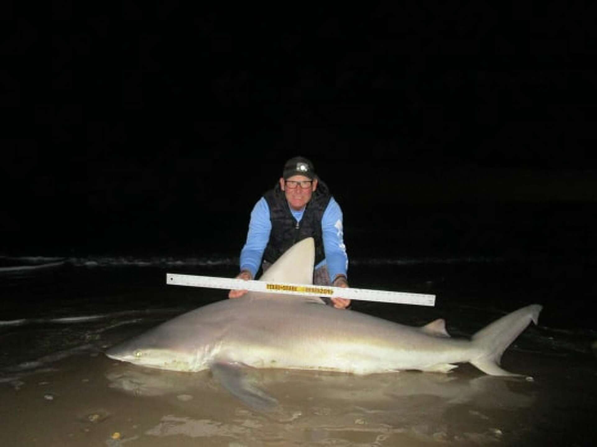 Texas man catches two 7-foot sharks in one day