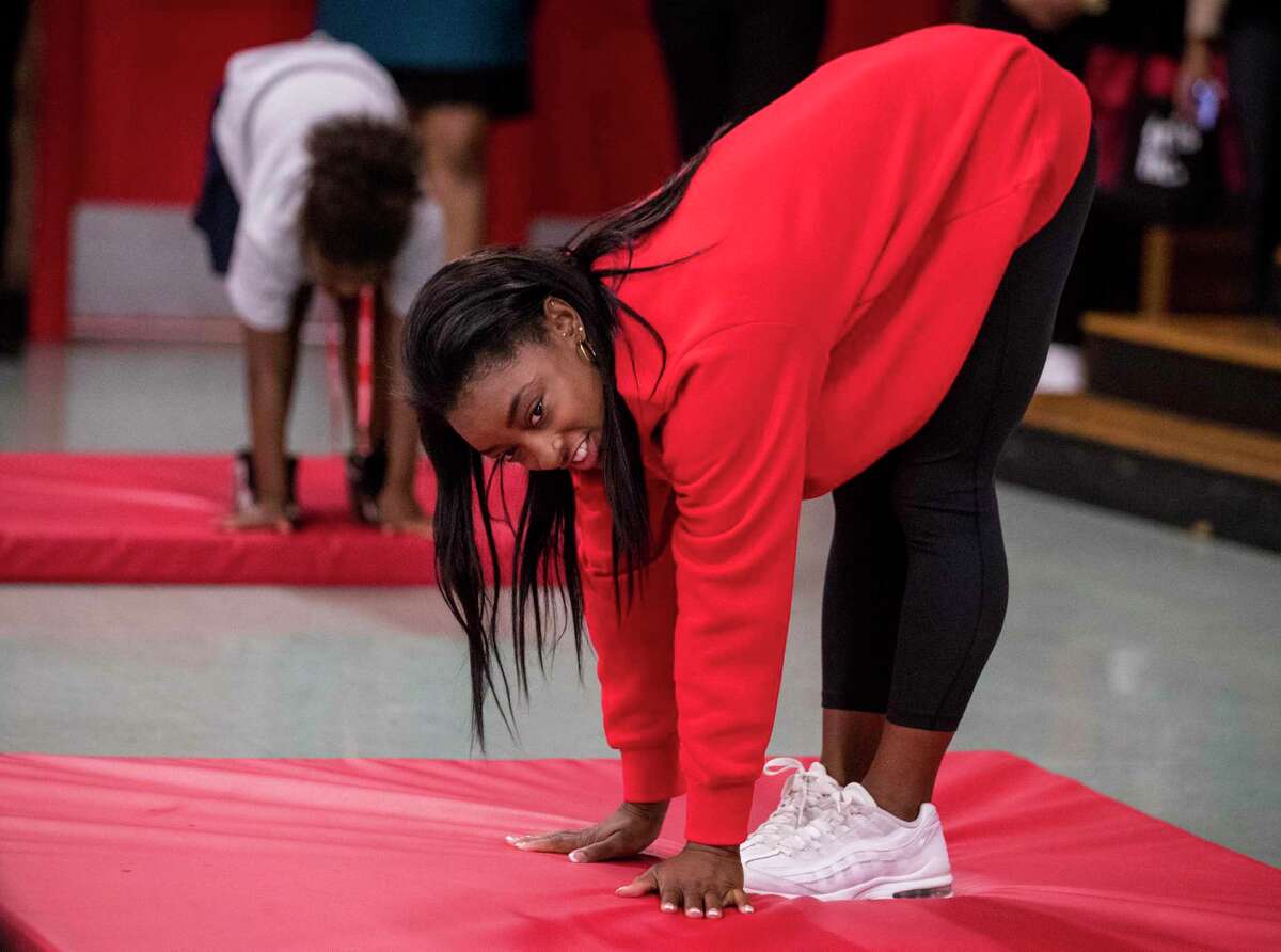 Olympic gold medalist Simone Biles surprises Houston elementary students