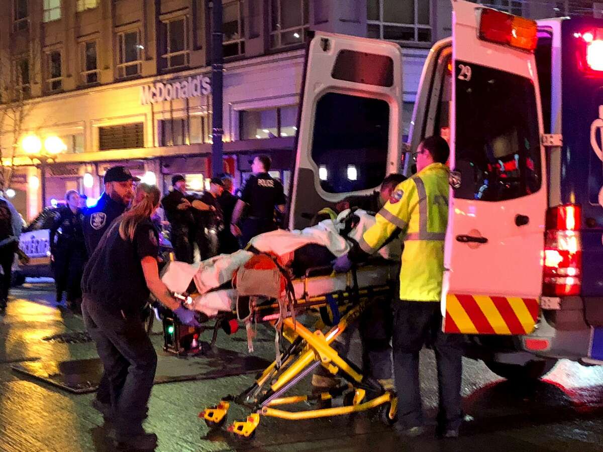 One dead, seven injured and suspect at large in downtown Seattle shooting
