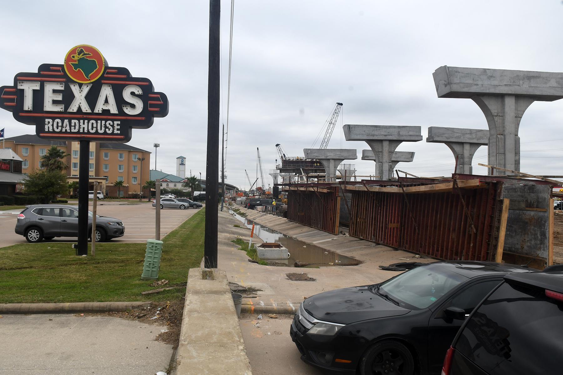 Businesses near construction of FM 1960/Hwy. 6 bridge over U.S. 290 ...
