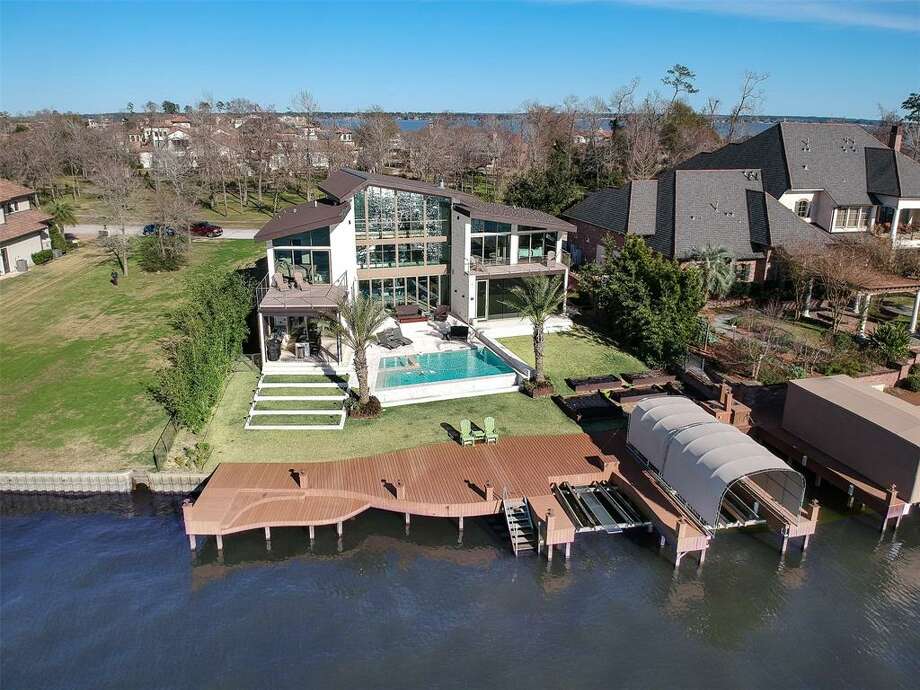 Live on a secluded island off Lake Conroe in this just listed, $4.25M ...