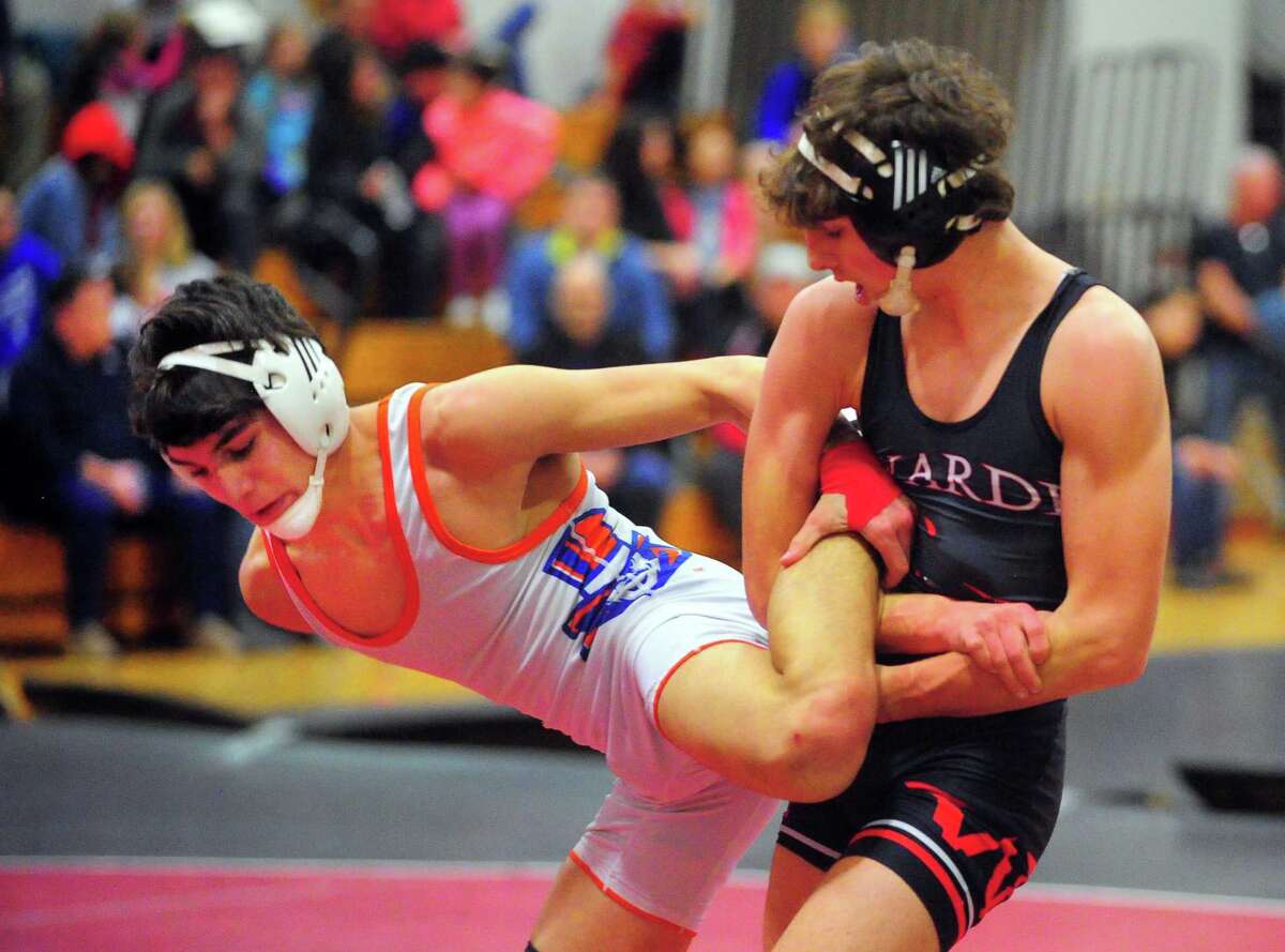 Danbury wrestling meets the challenge from Warde