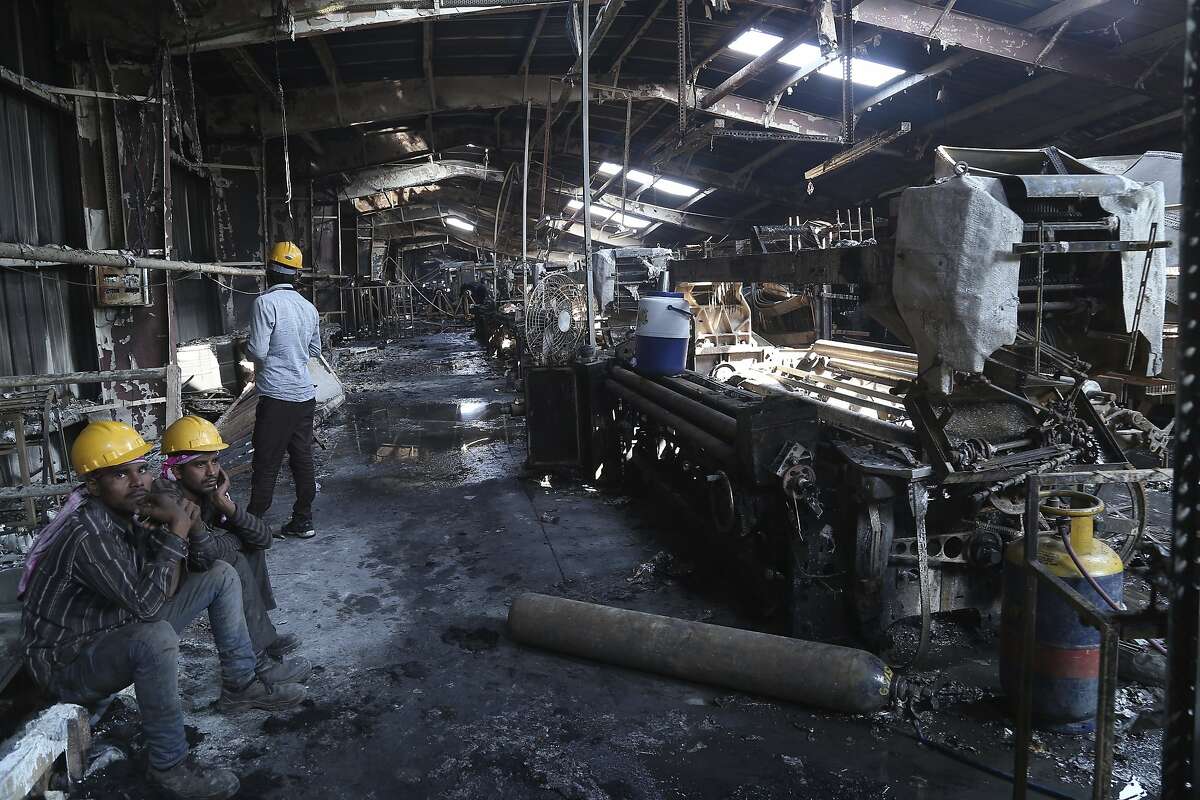 Burned India denim factory had single door reached by ladder