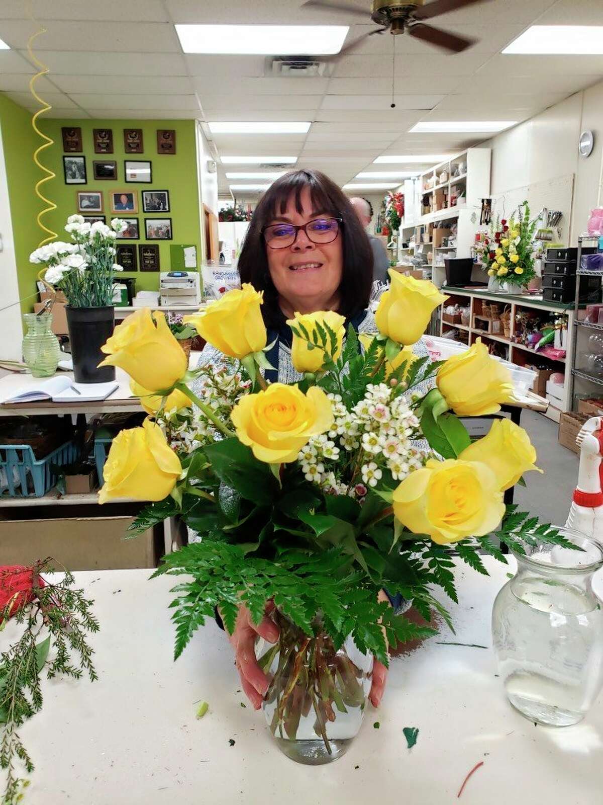 Two generations come together at florist shop