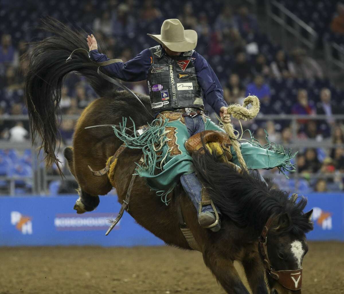 Saddle bronc rider Rusty Wright was down, but he wasn’t out