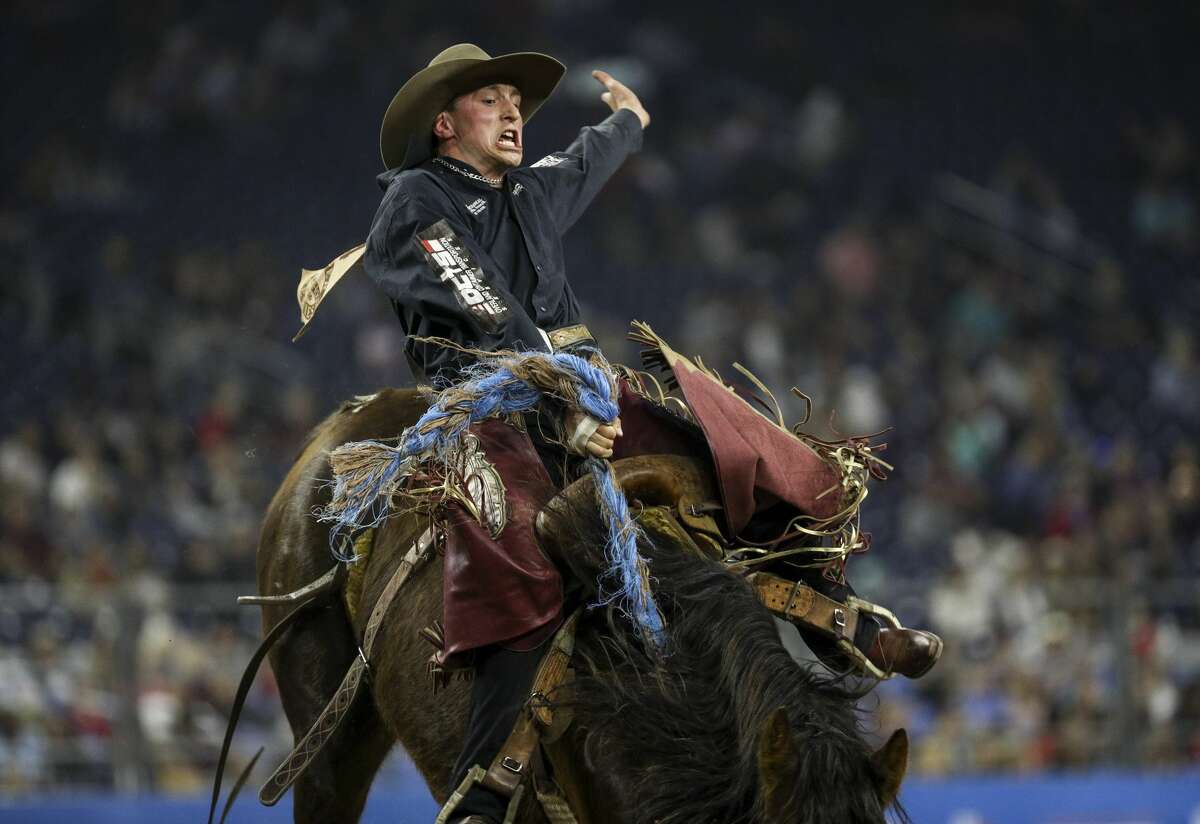 Saddle bronc rider Rusty Wright was down, but he wasn’t out