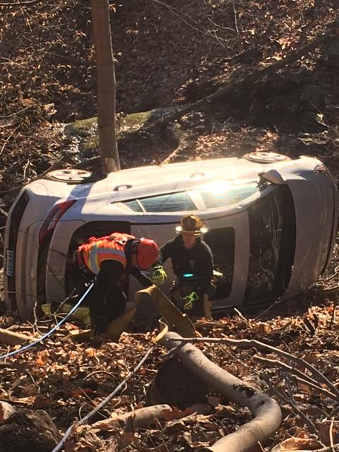 Fire crews use ropes to rescue crash victim