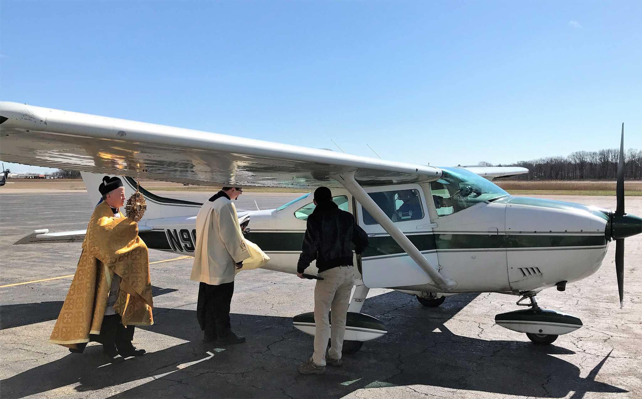 Trumbull priests fly over the Bridgeport Diocese praying, offering ...