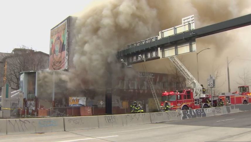 Fire at abandoned building sends thick smoke, closes SR 99