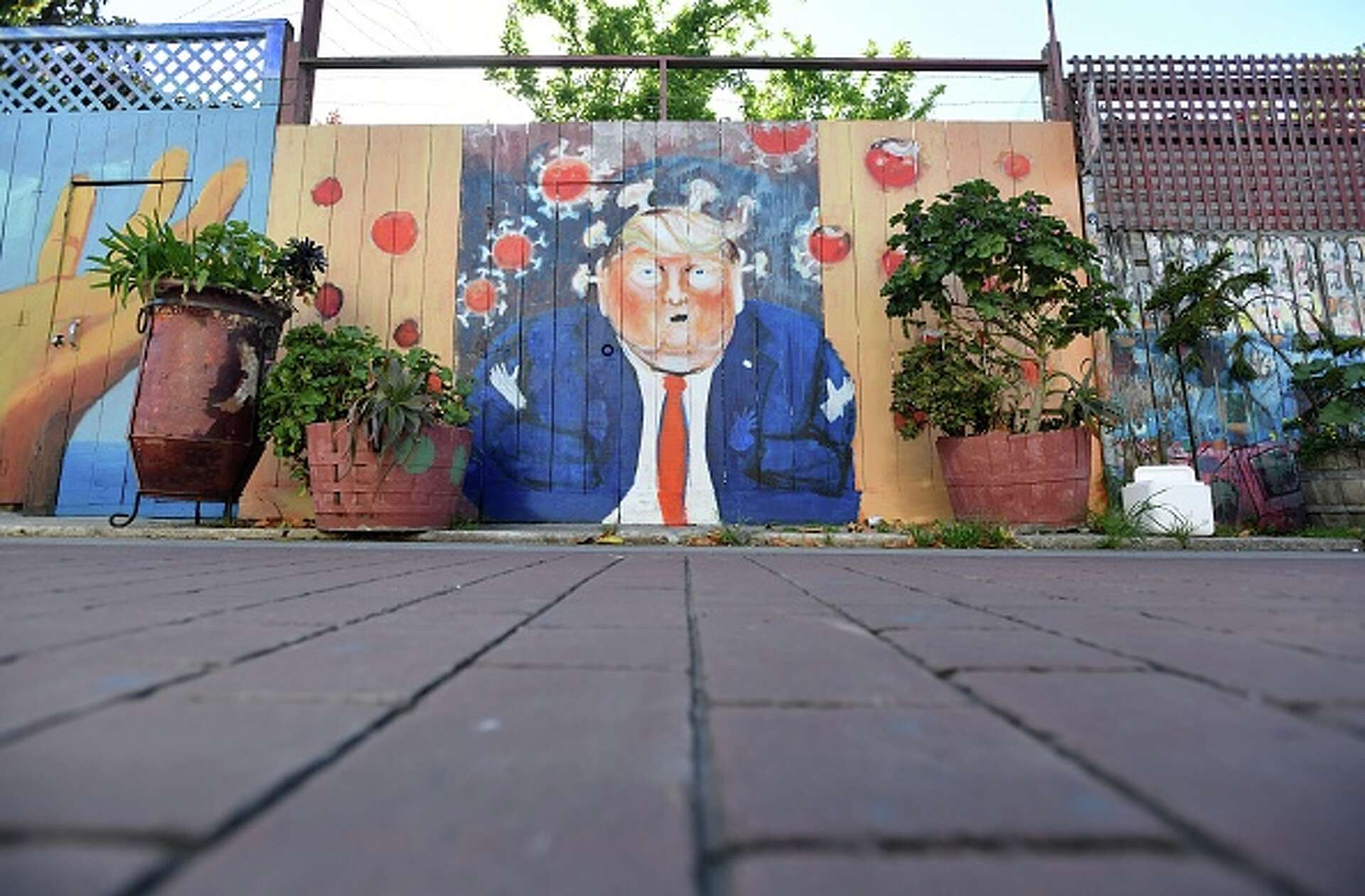 SF artist painted a mural of Trump turning into COVID-19. Then the ...