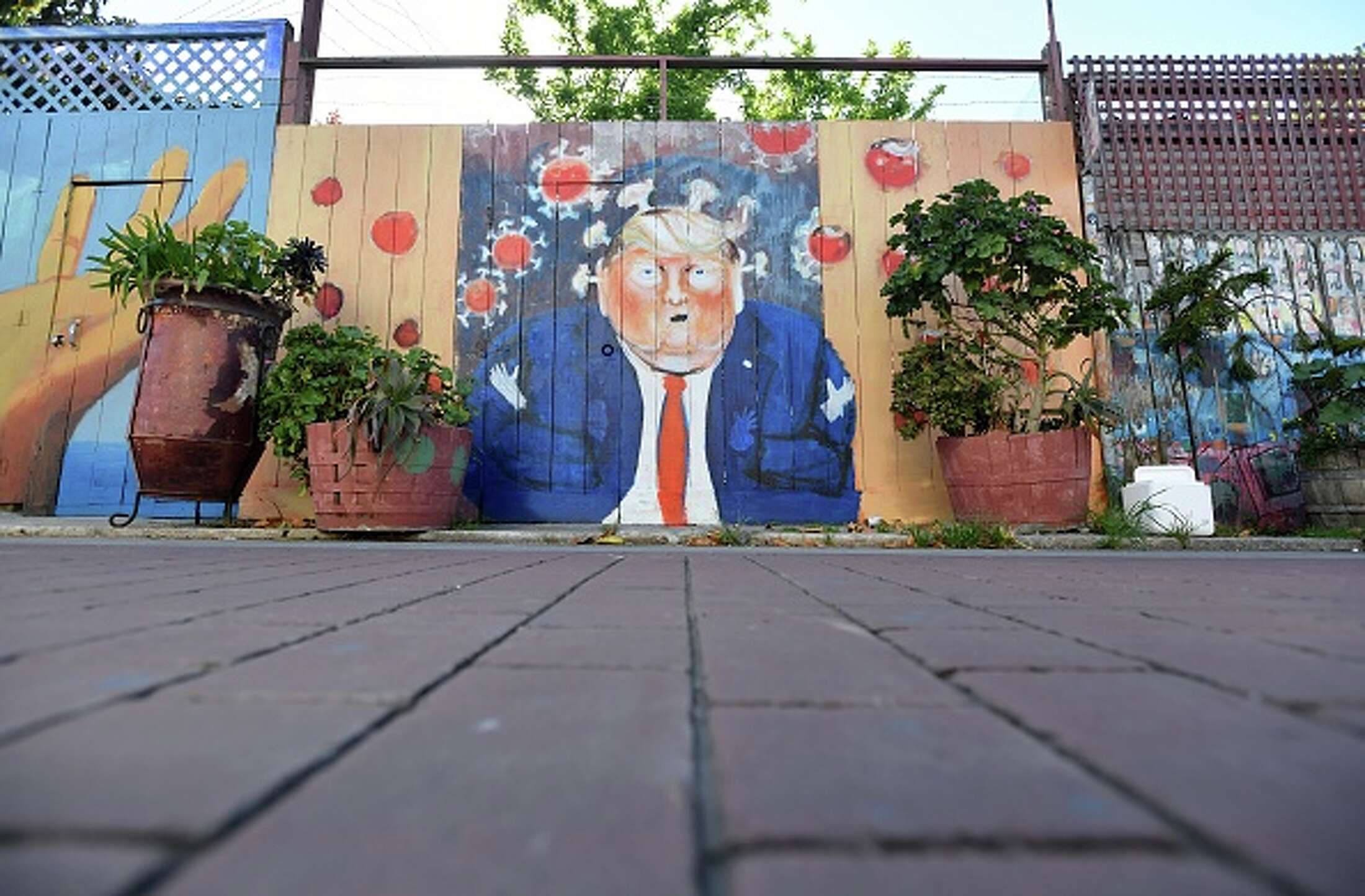 SF artist painted a mural of Trump turning into COVID-19. Then the ...