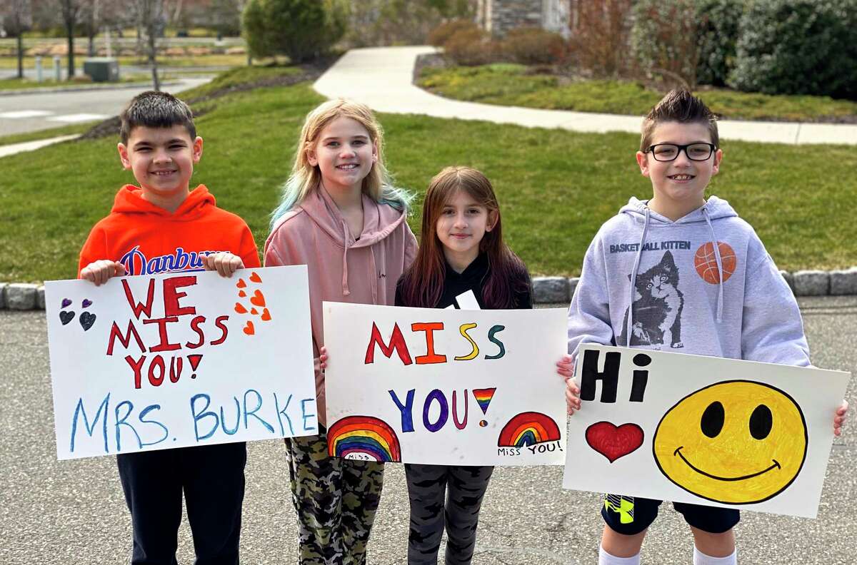 Danbury teachers hold car parade to see students