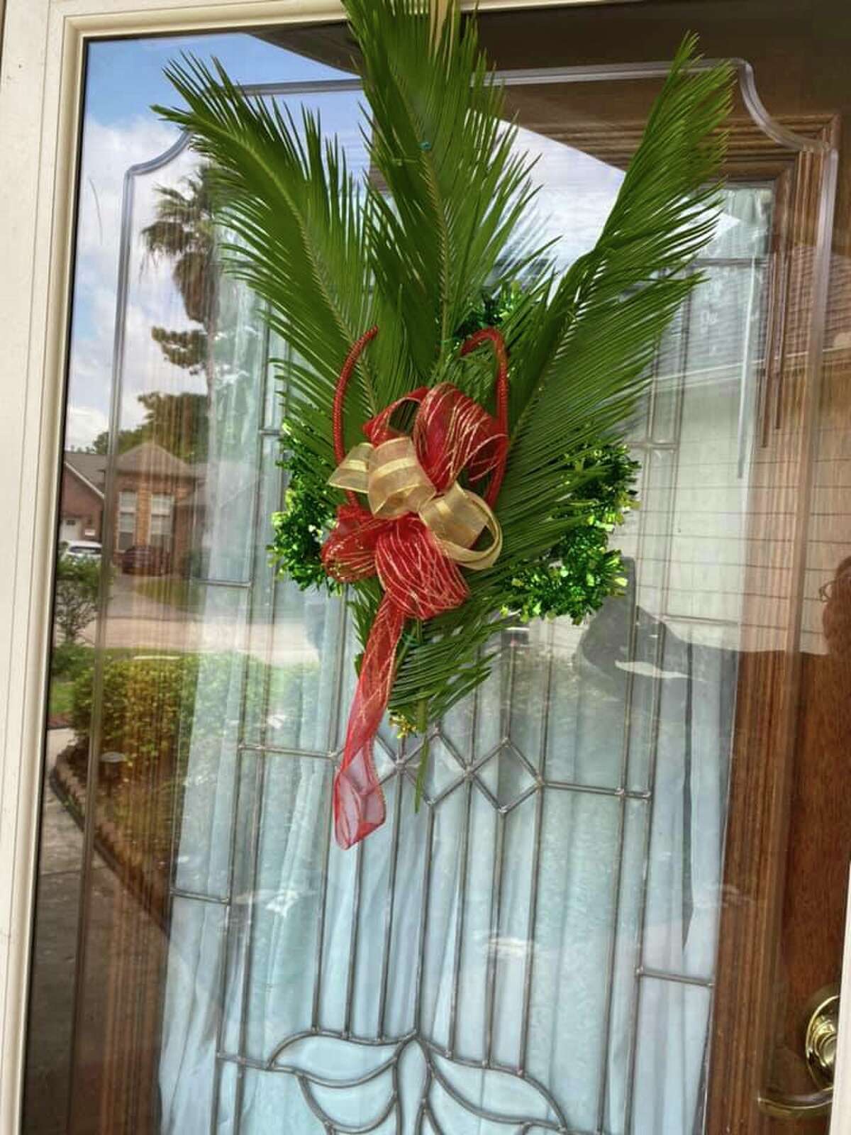 Houstonians display homemade palms on their doors in celebration of ...