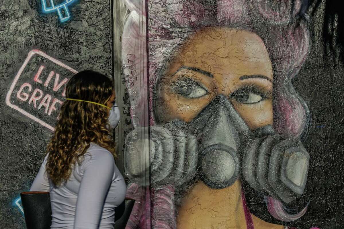 Street artists take on coronavirus with graffiti in Houston and beyond