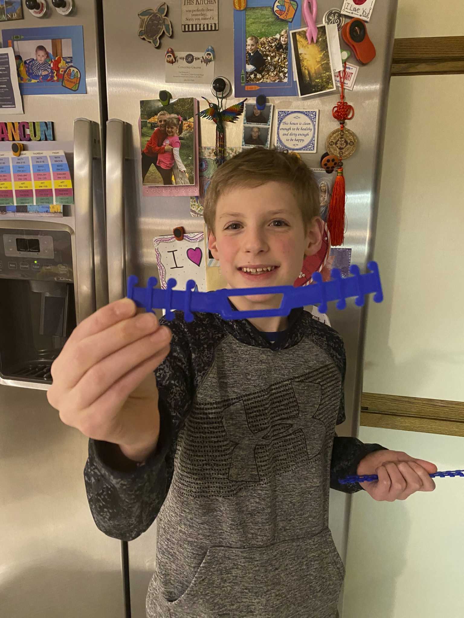 Nick Smith of Midland makes 115 face mask strap holders with 3D printer