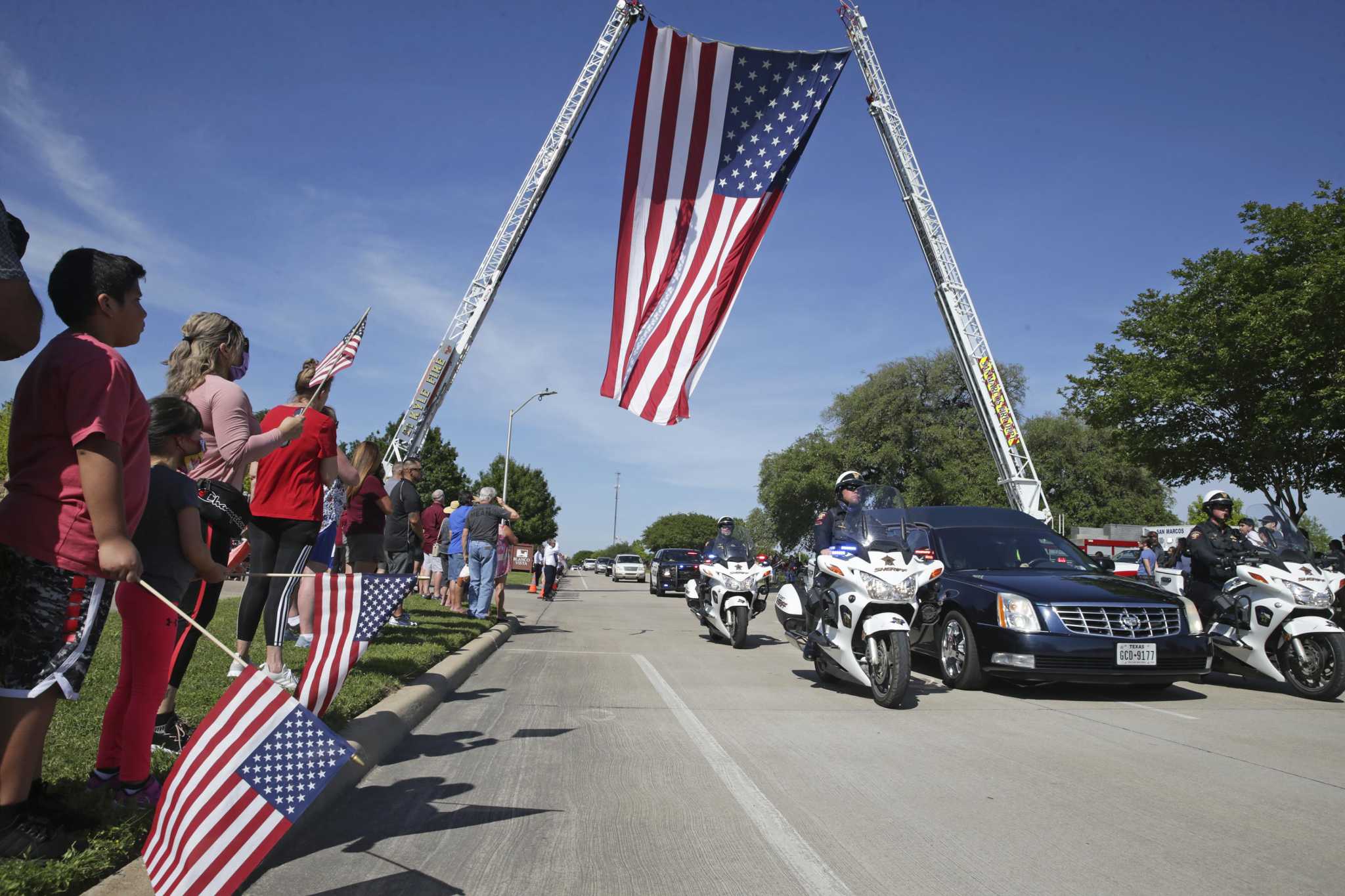 Residents line streets for San Marcos officer killed in the line of duty