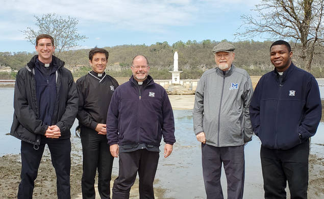 Clergy pray to shrine to fight the ‘rising waters of contagion’
