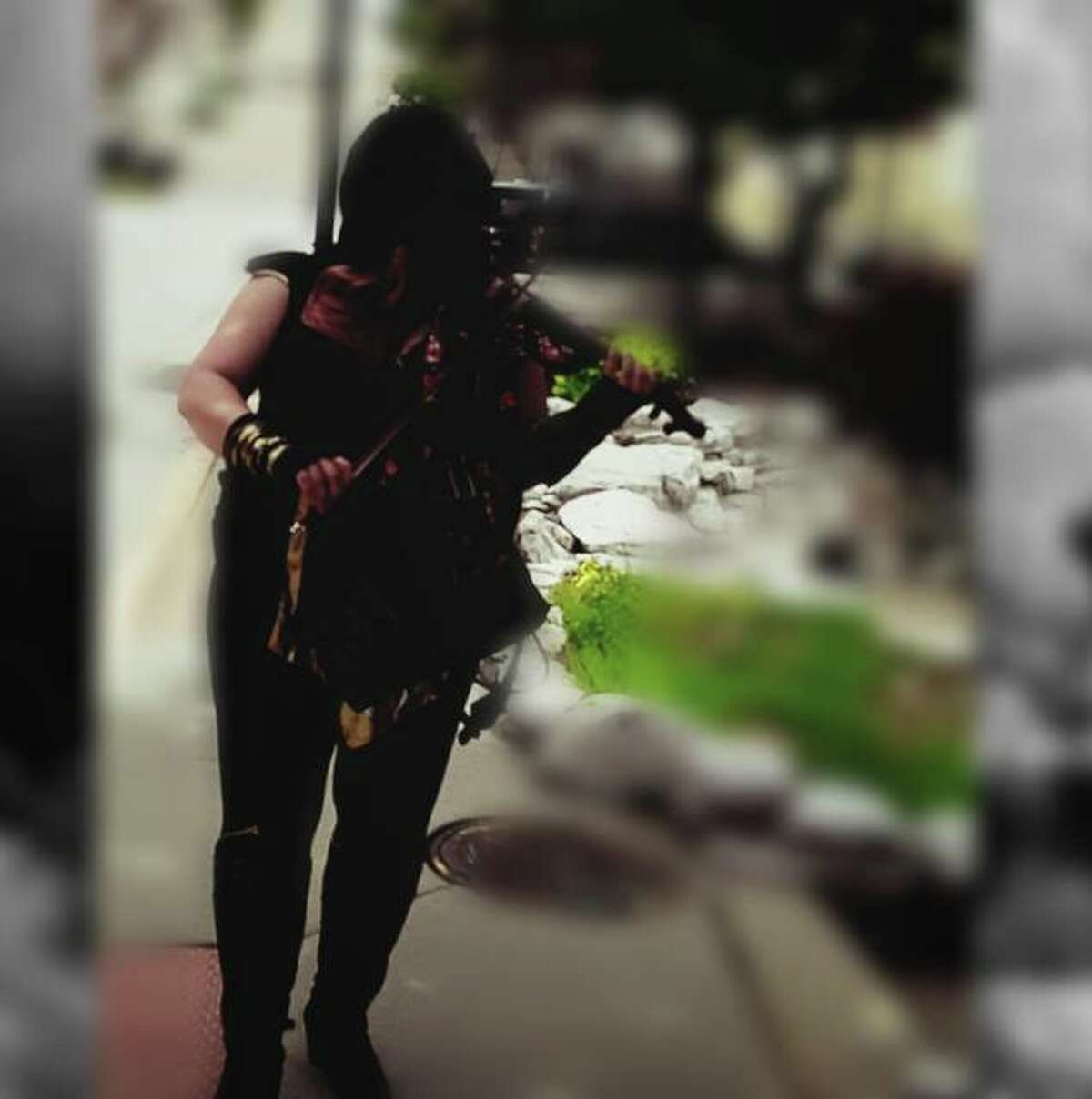 Mysterious, masked fiddler seen walking downtown Alton