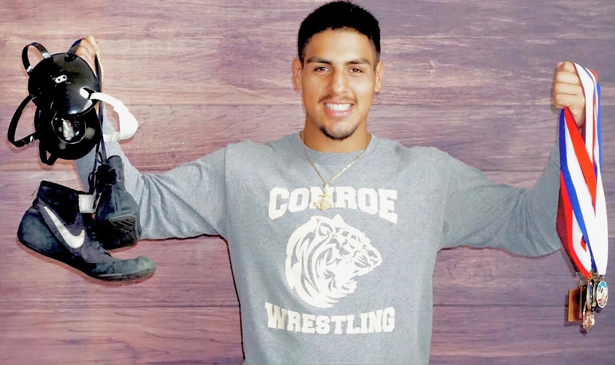 WRESTLING: Conroe’s Moya perseveres through senior year filled with ...