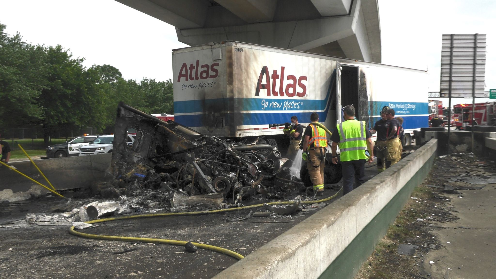 Big rig bursts into flames along North Freeway, driver burned