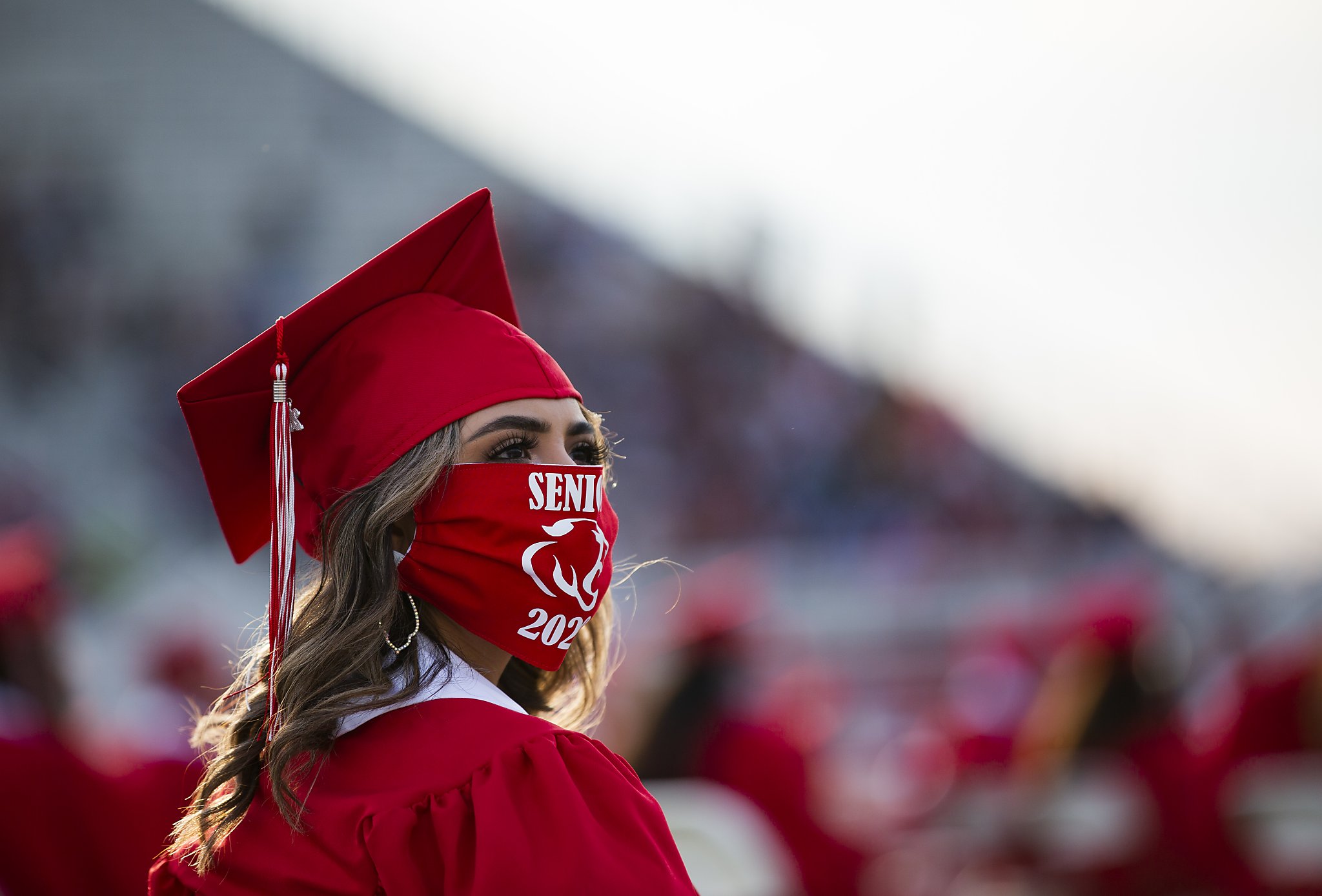 High school seniors brave pandemic guidelines, downpours for graduation