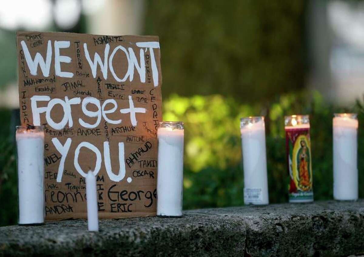 Hundreds kneel outside Houston City Hall in vigil to George Floyd