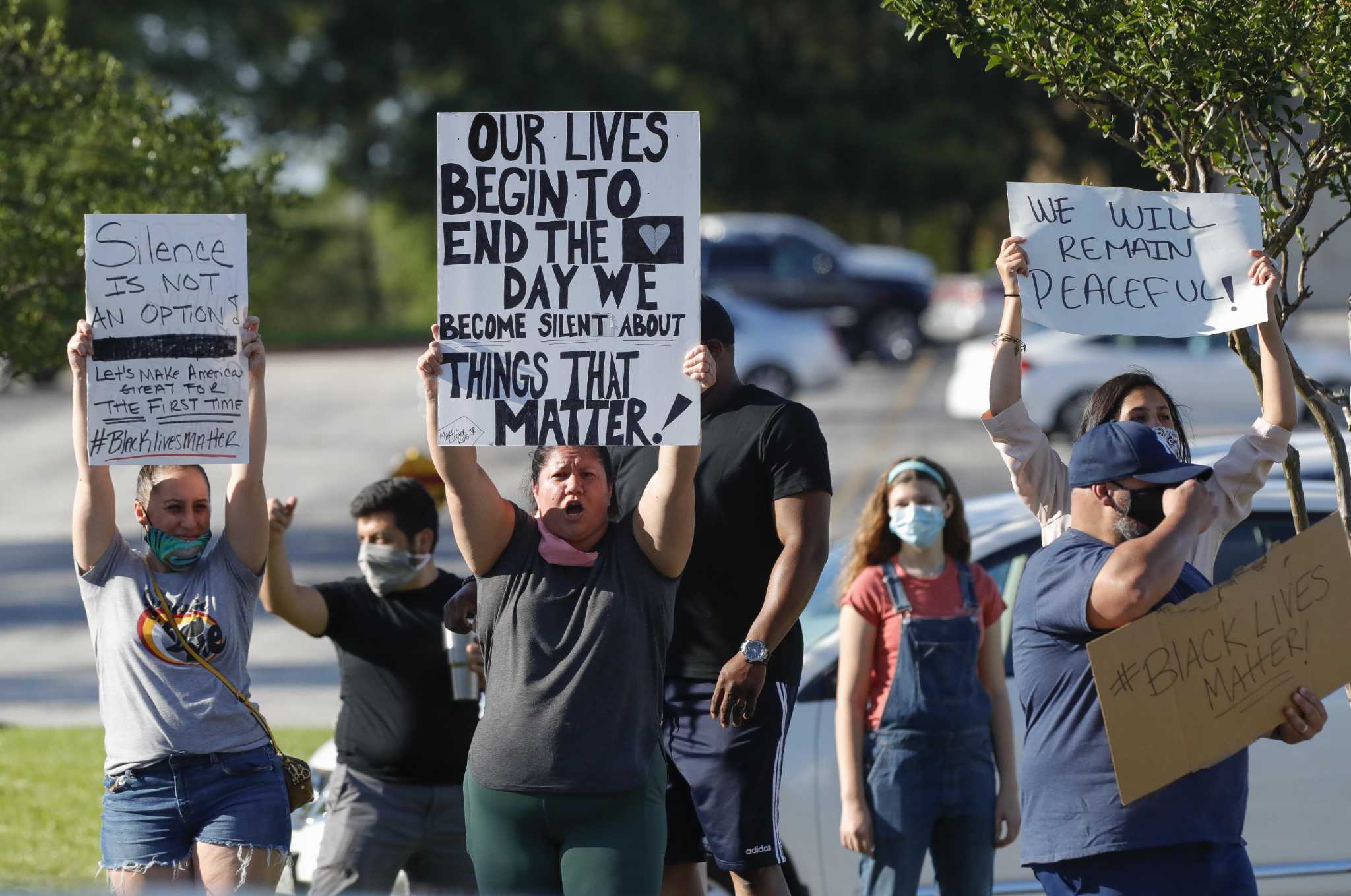 The Woodlands community members gather for peaceful protest