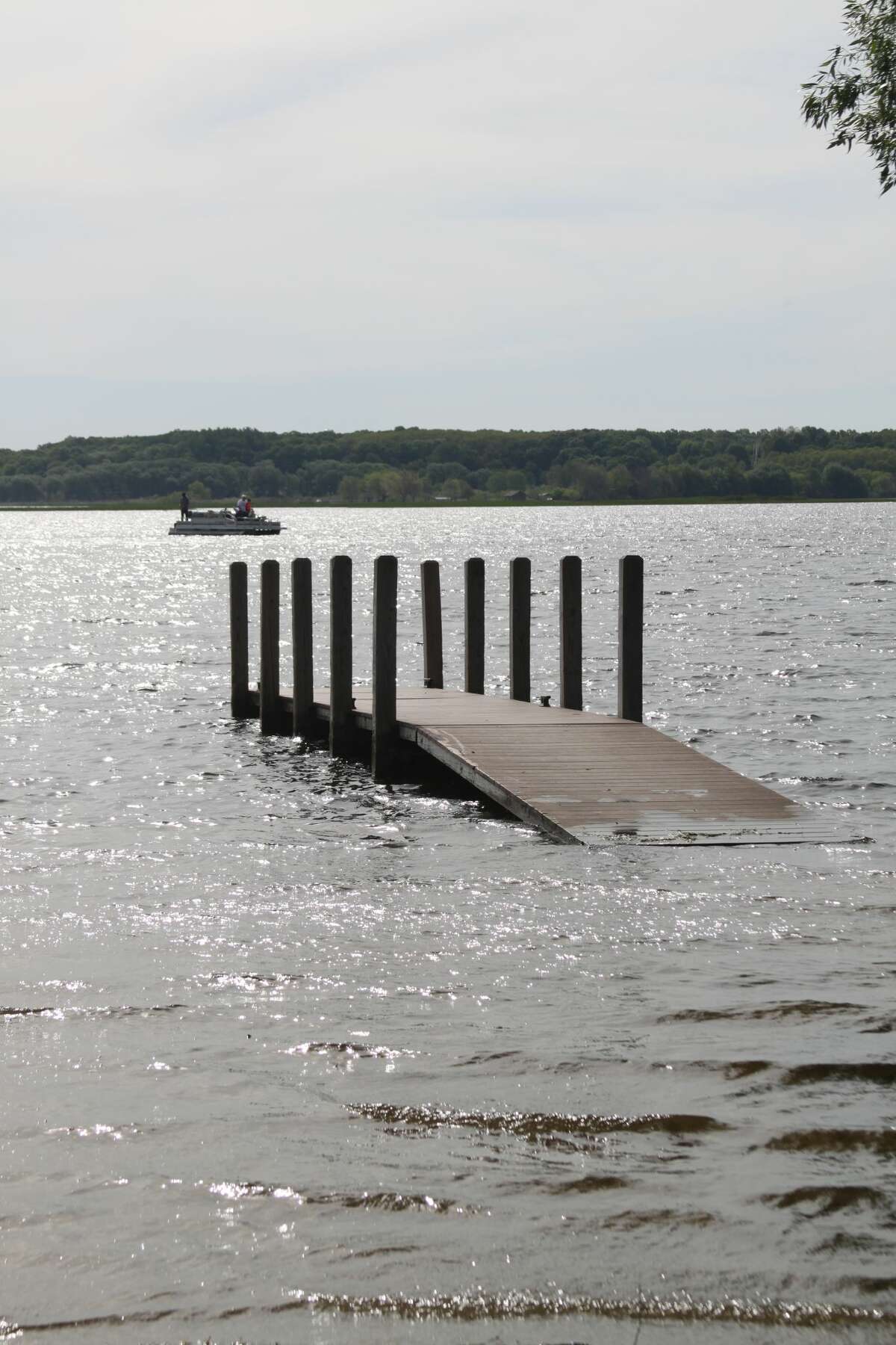 PHOTOS: Manistee Lake docks underwater, rain on the way