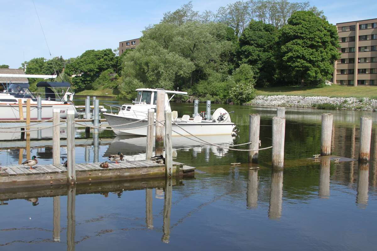 PHOTOS: Manistee Lake docks underwater, rain on the way