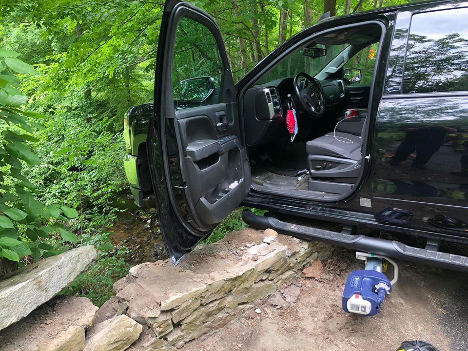 Person Pinned After Vehicle Crashes Into Rock Wall In Bethel