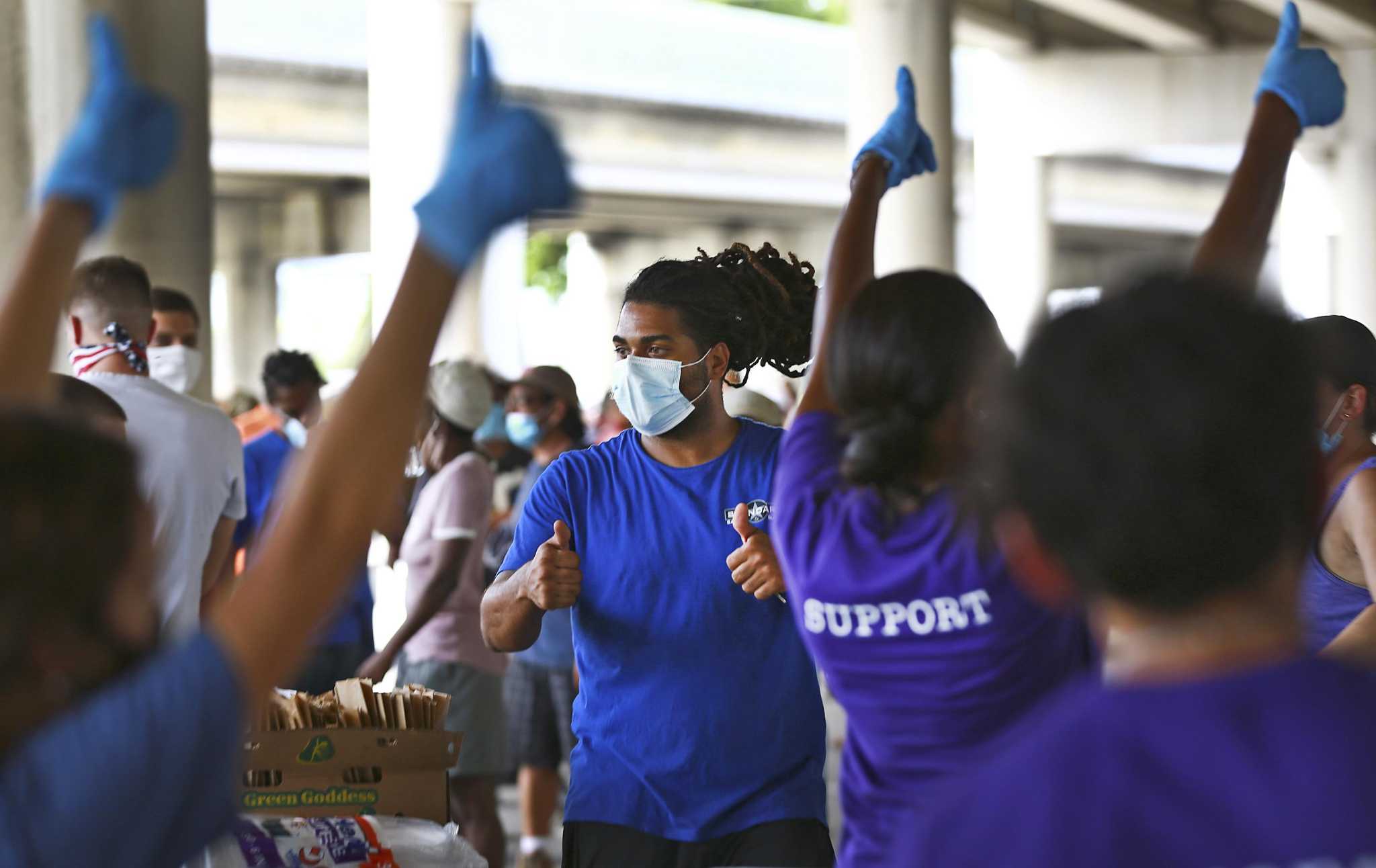 Protest group expands mission, feeds homeless downtown