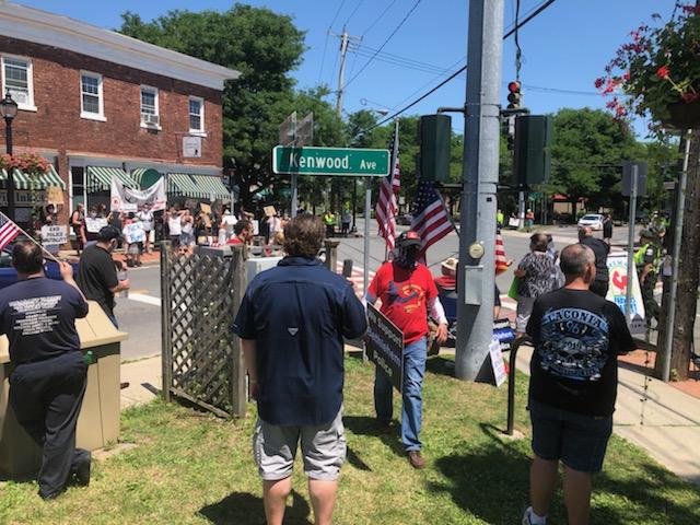 Tense moments at competing rallies at Delmar intersection