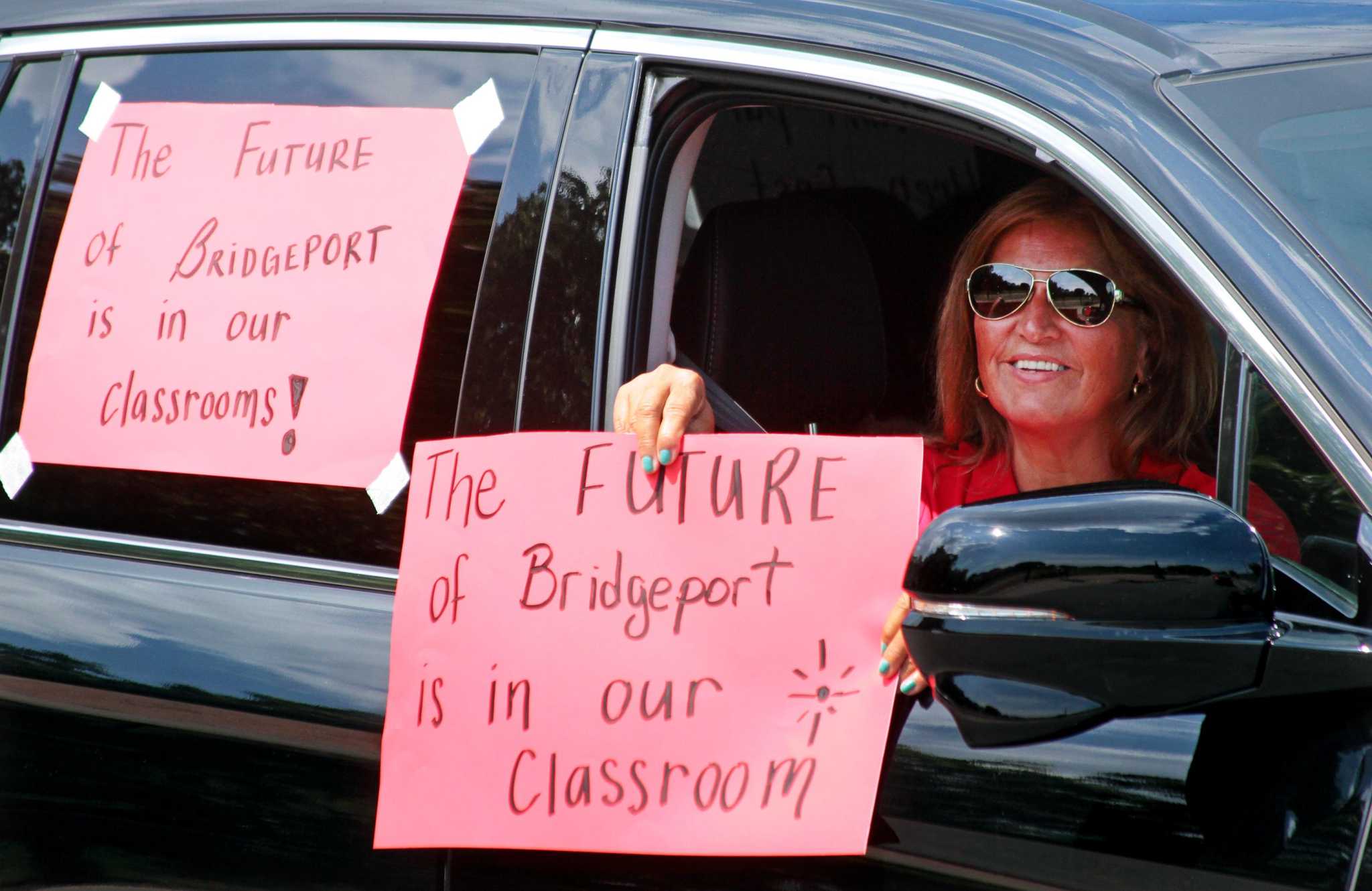 Teachers drive home the message that full, in-school instruction is a ...