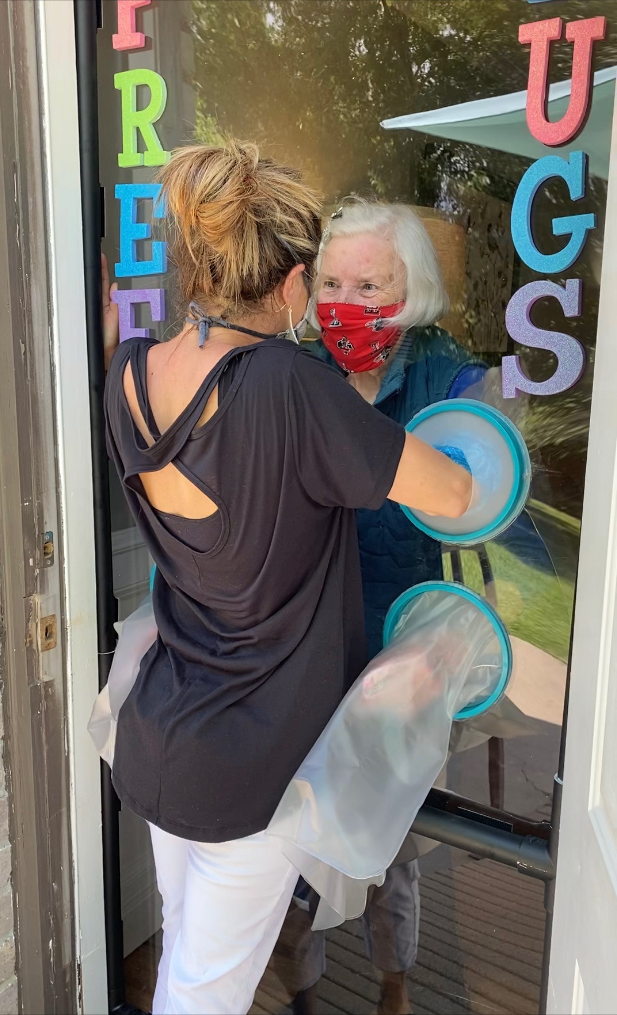 Houston-area couple creates pandemic-safe 'hugging booth' for seniors ...
