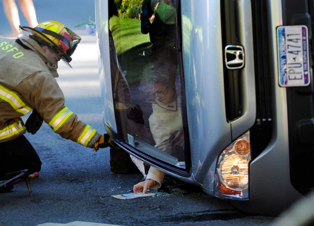 Crash leaves woman trapped in vehicle