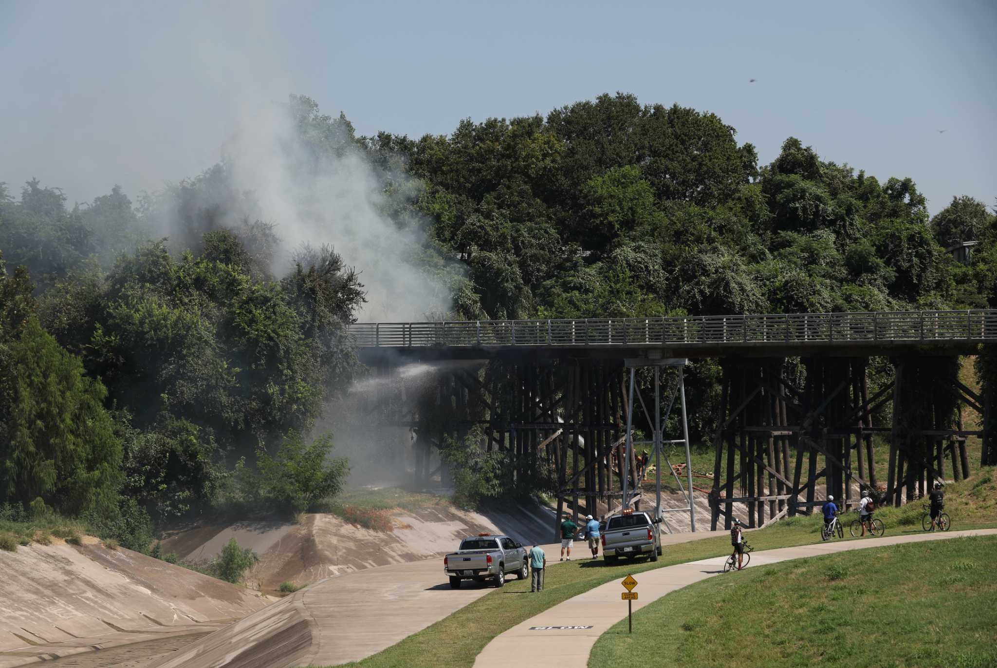 Fire erupts under White Oak Bayou pedestrian bridge