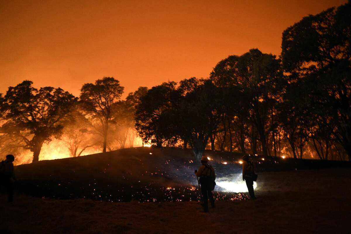 Fire crews 'fairly confident' they've stopped spread of destructive ...