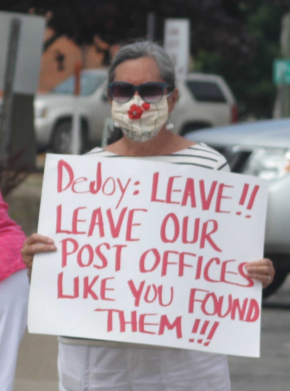 Meet the retired lawyer who organized the rally in support of the USPS