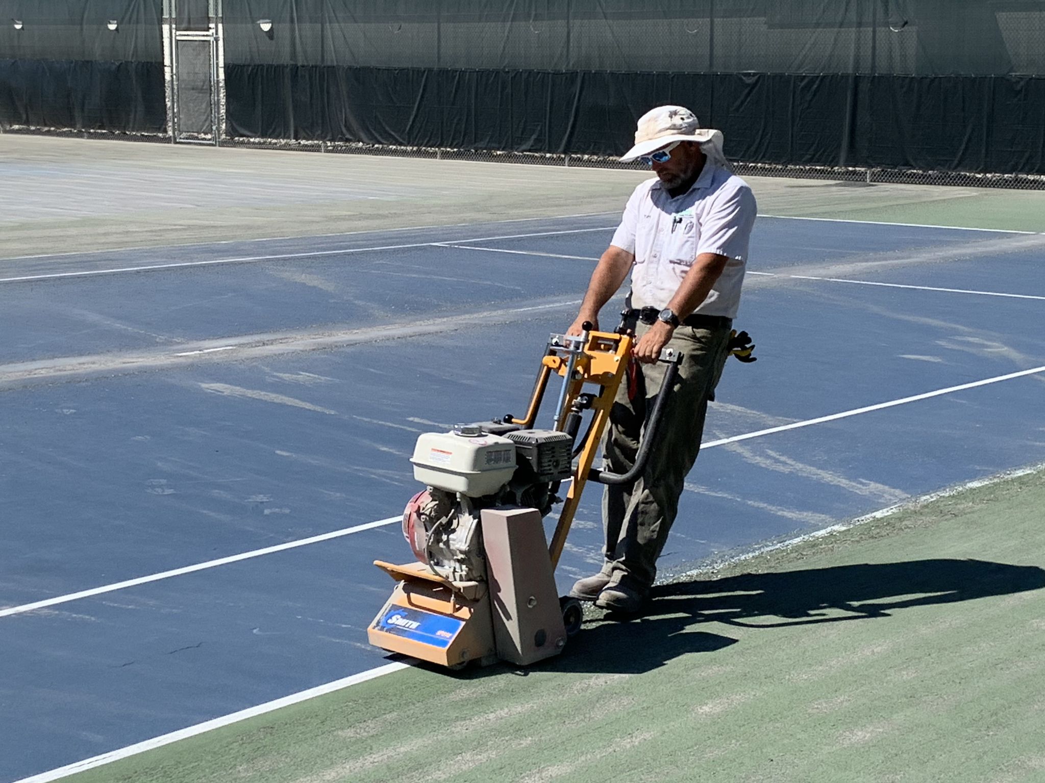 Work crews resurface Greater Midland Tennis Center's outdoor courts