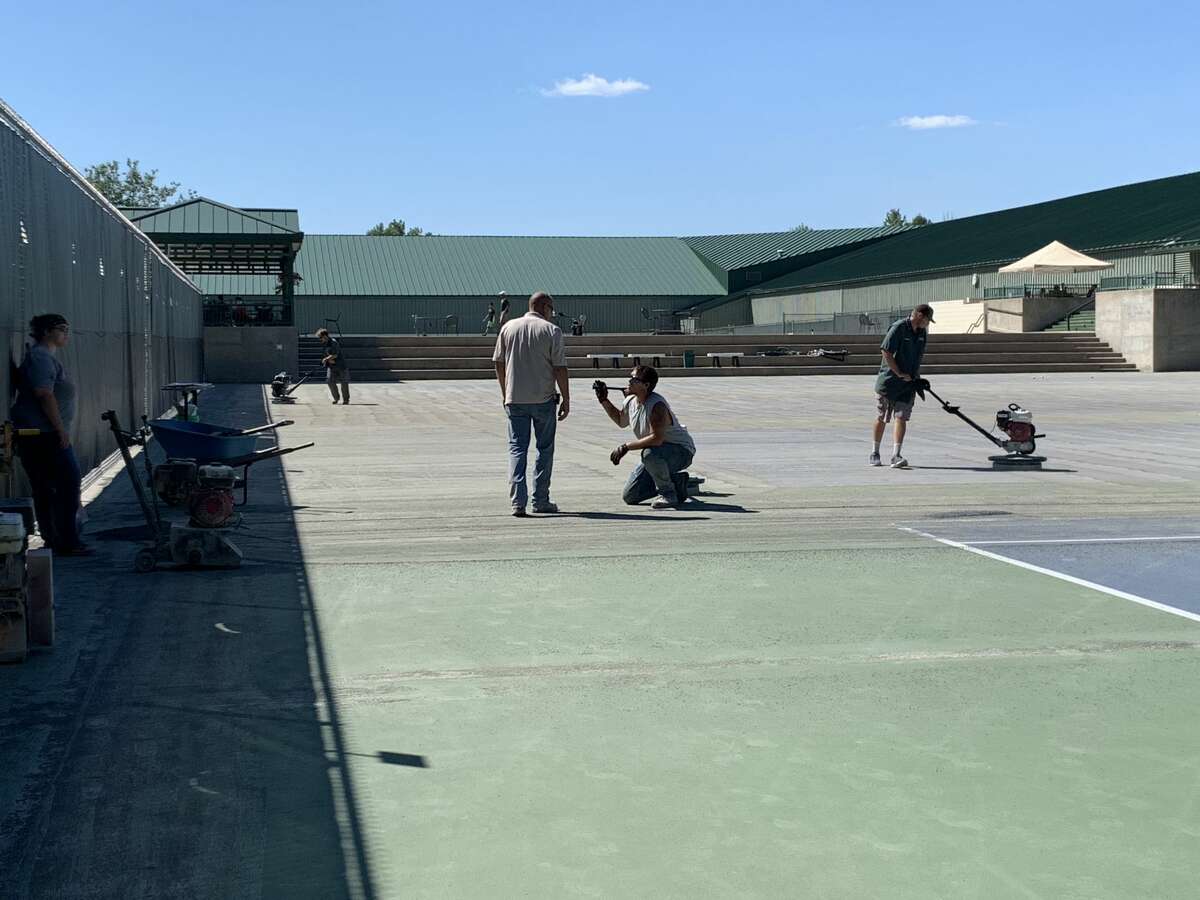 Work crews resurface Greater Midland Tennis Center's outdoor courts