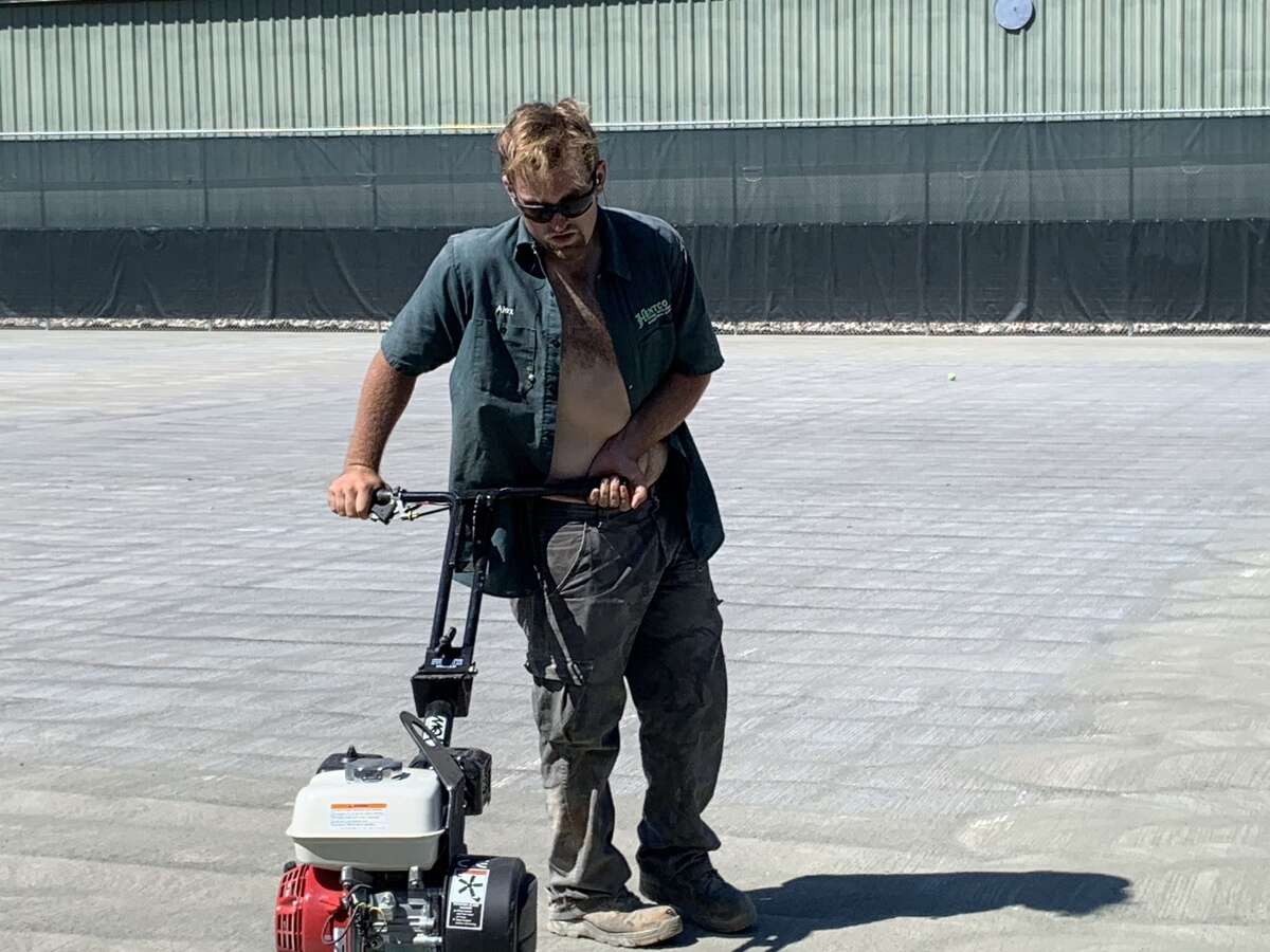 Work crews resurface Greater Midland Tennis Center's outdoor courts