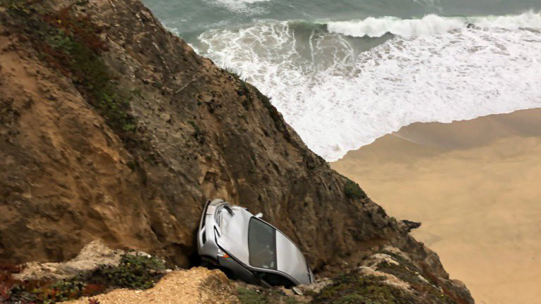 Woman dies after car careens off cliff on Hwy. 1