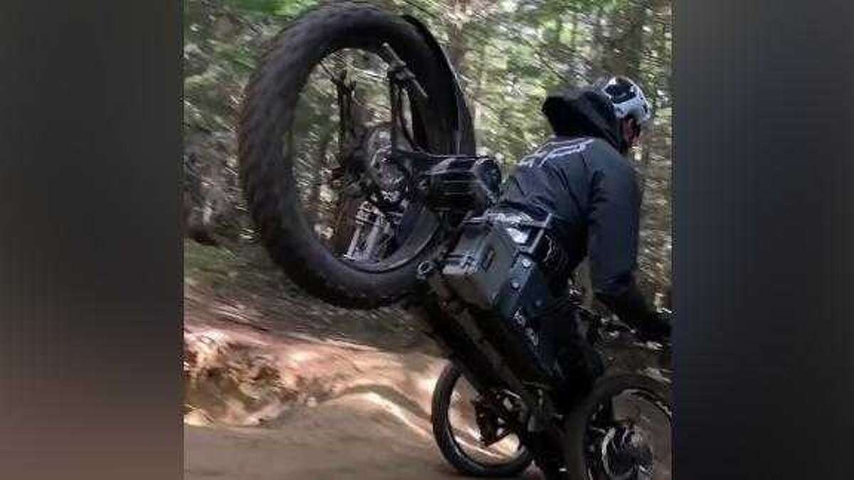 Watch this paralyzed man's epic stunts on custom mountain bike