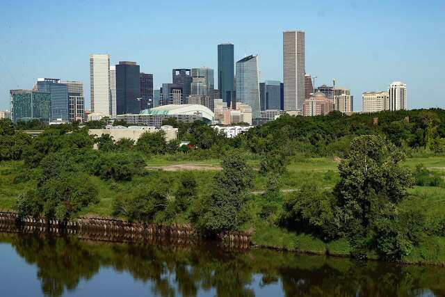 Why are Houston's bayous lined with concrete?