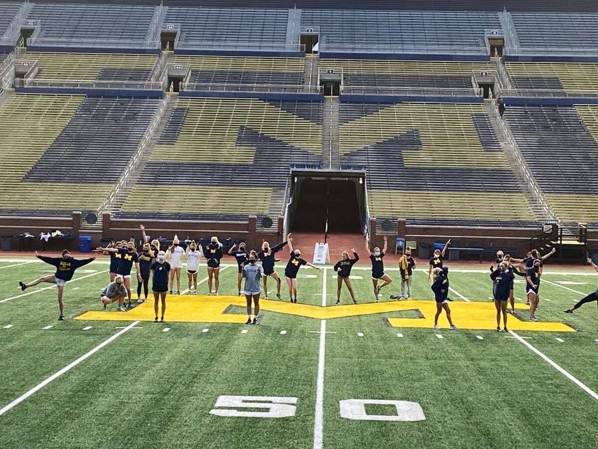 Photos: Newman and U-M swim team work out at Michigan Stadium