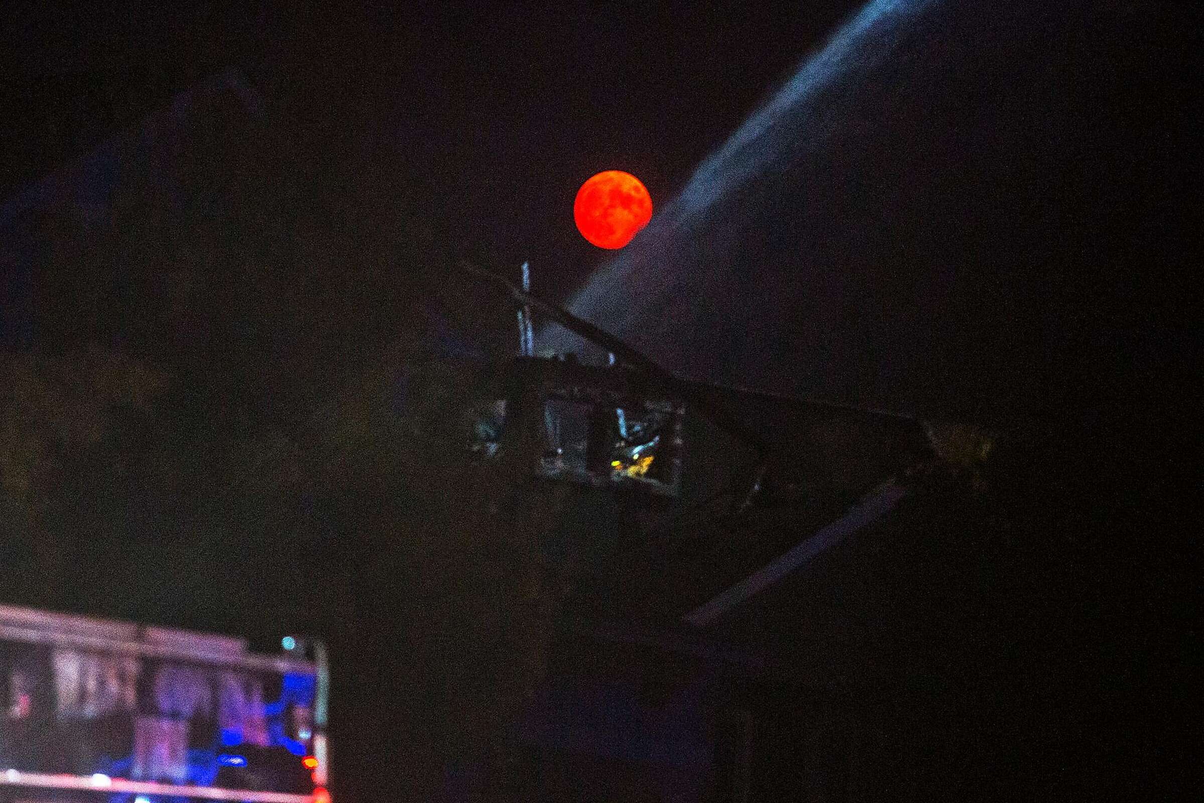 Air pollution from wildfire smoke creates crimson moon, worrying scientists