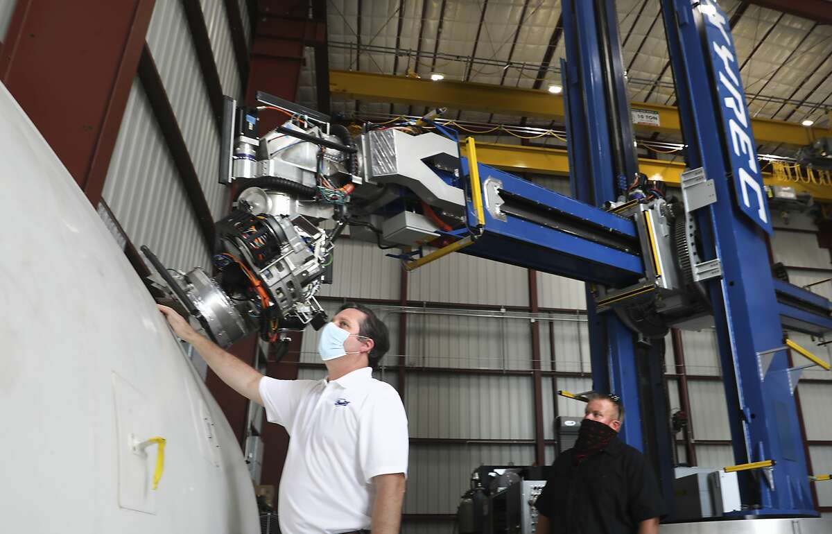 7-story-tall robot ready to laser airplane paint at Port San Antonio