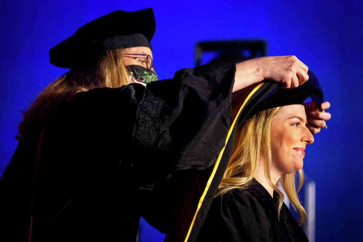 Law school grads finally get to don caps and gowns at graduation events