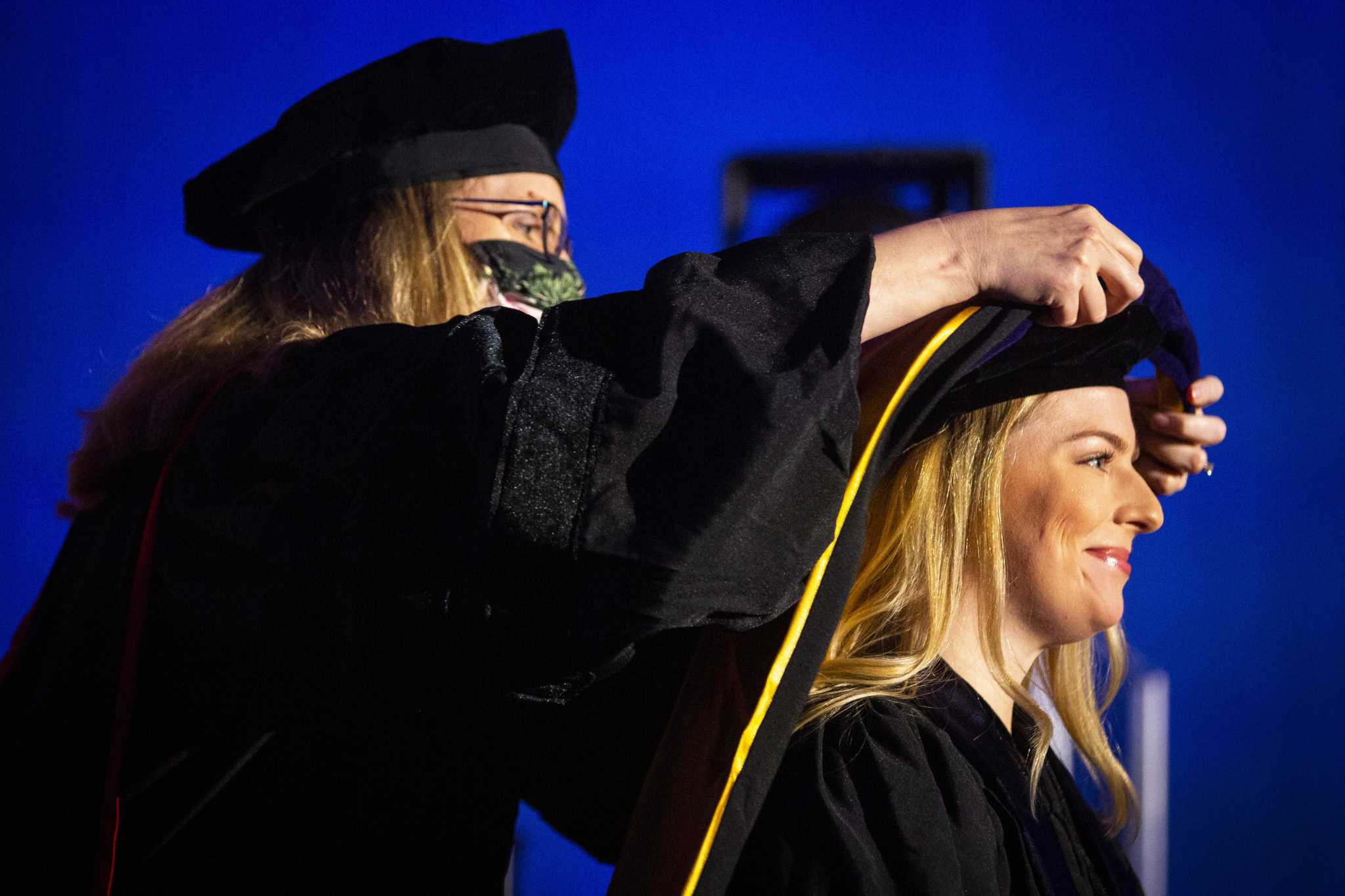 Law school grads finally get to don caps and gowns at graduation events